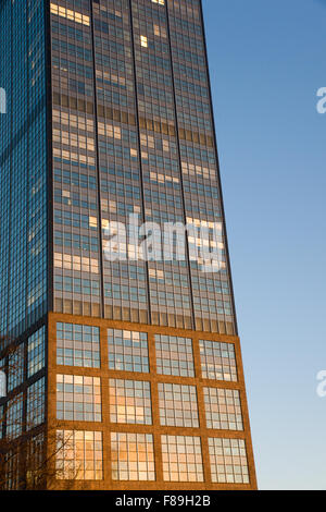 Corporate background of early morning sun rays illuminating a glass ...