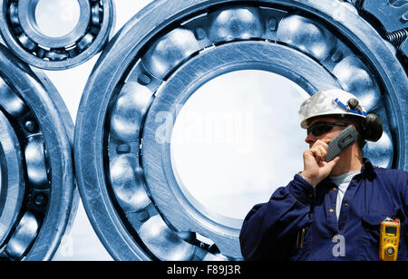 engineer, industry worker with giant ball-bearings and gears Stock ...