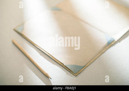 Vintage pencil and drawing paper. Weak sunlight Stock Photo - Alamy