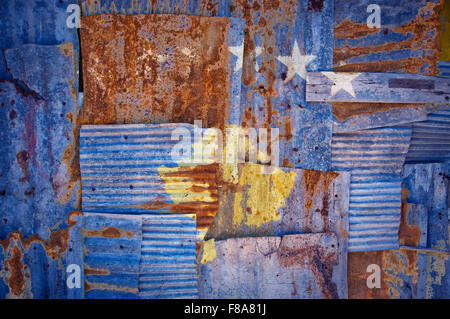 An old image of the flag of Kosovo on a wall with a crack. A crisis ...