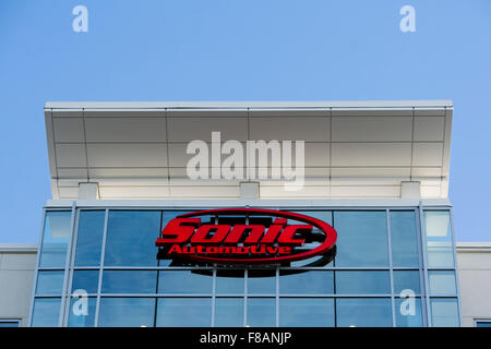 A logo sign outside of the headquarters of Sonic Automotive, Inc., in ...