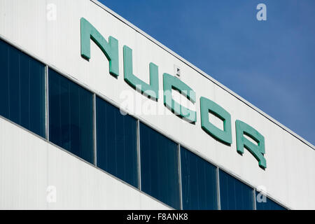 A logo sign outside of the headquarters of the Nucor Corporation in ...