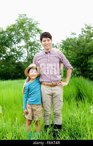 Boy staring at father Stock Photo - Alamy