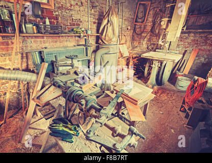 Vintage stylized old carpenter workshop interior Stock Photo - Alamy