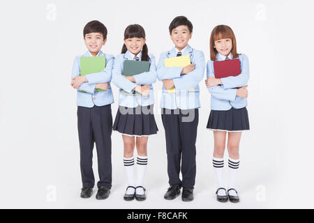 Two kids of school age with book exploring this great world Stock Photo ...