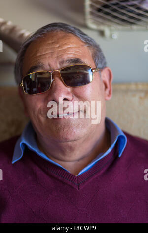 Portrait of a handsome Tibetan man Stock Photo - Alamy