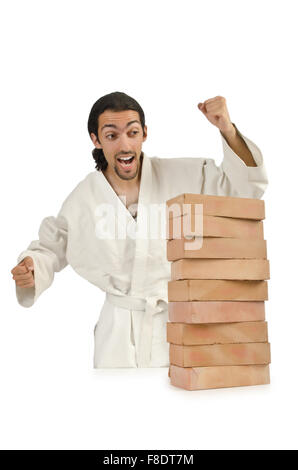 Karate man breaking bricks on white Stock Photo - Alamy