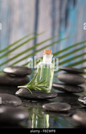 Beautiful composition with bottle of essential oil and natural ...