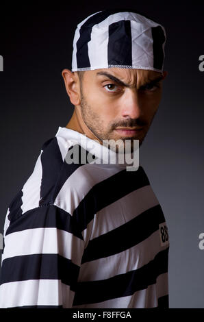 Angry prison inmate in dark room Stock Photo - Alamy
