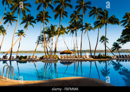 A stunning infinity swimming pool and beach on the tropical Island of ...