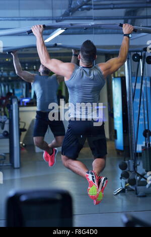 Strong handsome man exercising at the gym Stock Photo - Alamy