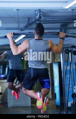 Strong handsome man exercising at the gym Stock Photo - Alamy