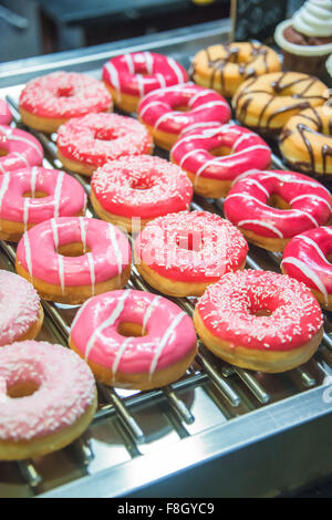 Sweet donuts arranged at display Stock Photo - Alamy