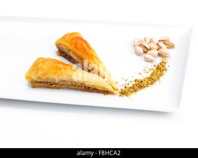 traditional dessert turkish baklava,well known in middle east and delicious isolated on white ...
