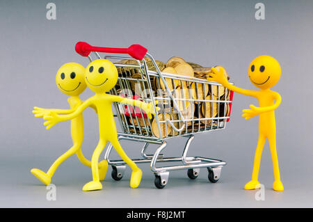 Smilies with shopping carts and coins Stock Photo - Alamy