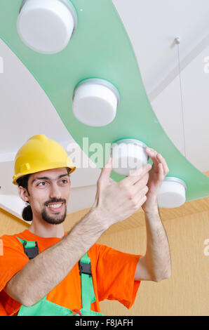 Electrician working on cabling lighting Stock Photo - Alamy