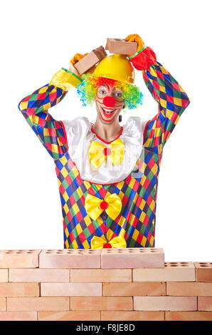 Bad construction concept with clown laying bricks Stock Photo - Alamy