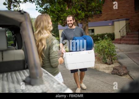 The young couple preparing for trip Stock Photo - Alamy