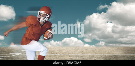 Composite image of calm rugby player thinking while holding ball Stock ...