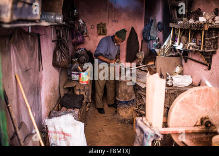 A traditional Arabic blacksmith working in Katara cultural village ...
