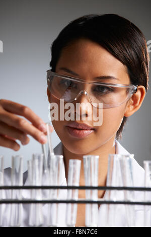 The female scientist with test tubes in the laboratory Stock Photo - Alamy