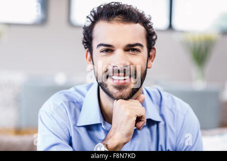 Thoughtful man looking at camera Stock Photo - Alamy