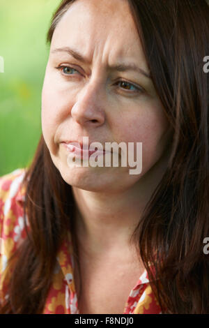 Serious thoughtful middle aged female looking out the window at home Stock Photo - Alamy