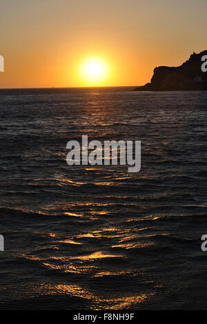 romantic sunset at sea eith tourist and travel boats on horizon Stock ...