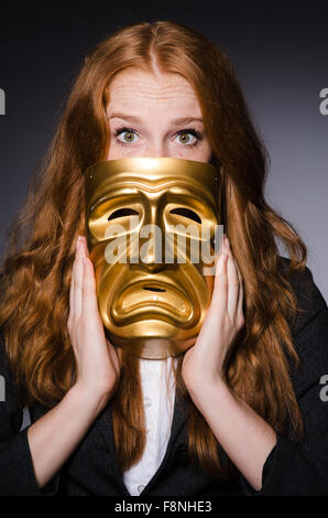 Young businesswoman in funny disguise with megaphone isolated on white ...