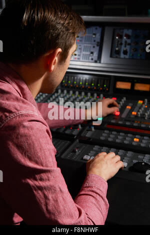 Engineer Working At Mixing Desk In Recording Studio Stock Photo - Alamy