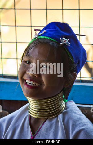 The Kayan women wear brass coils around their necks to give the ...
