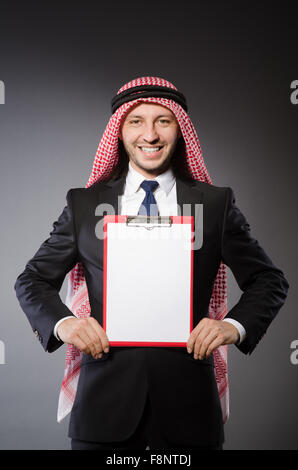 Arab man with paper binder Stock Photo - Alamy