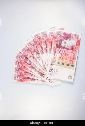 A fan made of fifty pound sterling notes money Stock Photo - Alamy