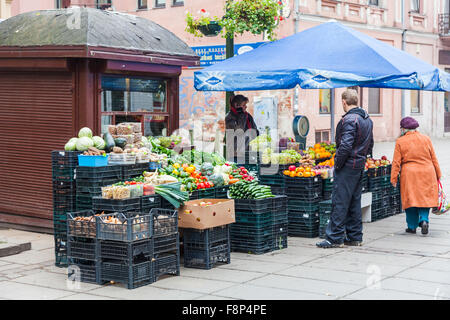 Roadside pavement stall selling fruit and vegetables to local people in ...