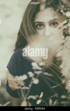 Scared girl hiding outdoors Stock Photo - Alamy