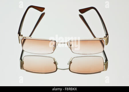 Stylish sun glasses on highly reflective background Stock Photo - Alamy
