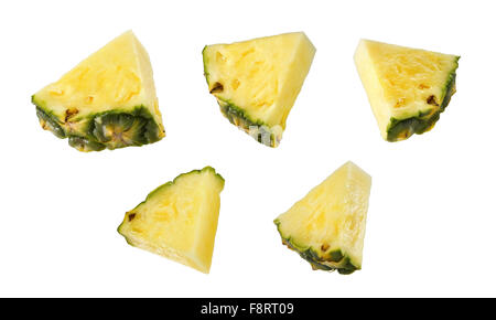 Piece of fresh ripe pineapple cut from the whole fruit isolated on ...