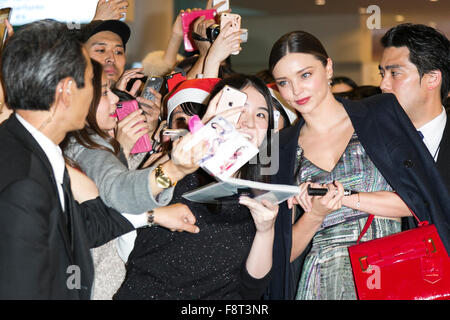 Australian supermodel Miranda Kerr takes a picture with fans at Narita ...