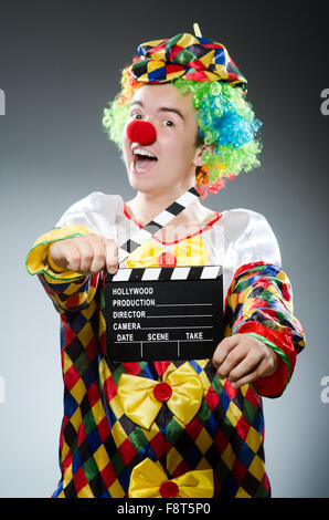 Clown with the movie board Stock Photo - Alamy
