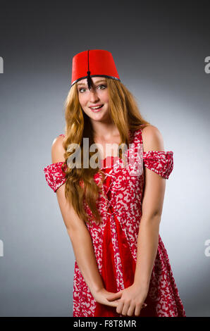Woman wearing red fez hat Stock Photo - Alamy