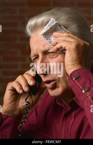 Handsome middle age doctor man working at the clinic suffering pain on ...