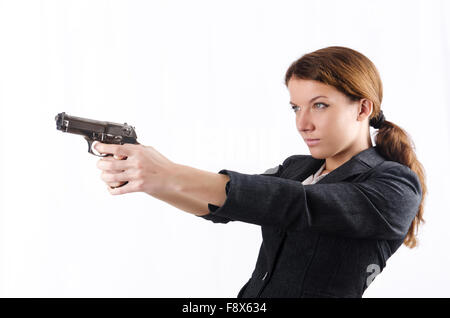 Woman businewoman with hand gun Stock Photo - Alamy