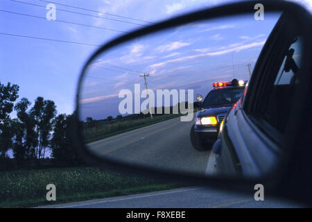 Police car in rearview mirror Stock Photo - Alamy