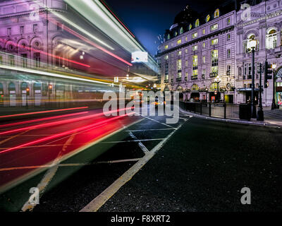 Taxi at night blur in Piccadilly Circus London Stock Photo - Alamy