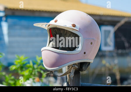 Motorcycle helmet on fence in desert Stock Photo - Alamy