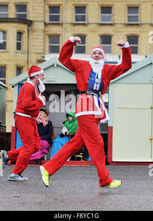 Hundreds of people dress up as Santa Claus for the Santa Run London ...