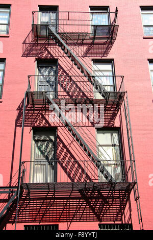 Facade of a house with a fire escape, Harlem, Manhattan, New York City ...