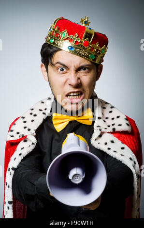 King with loudspeaker in funny concept Stock Photo - Alamy