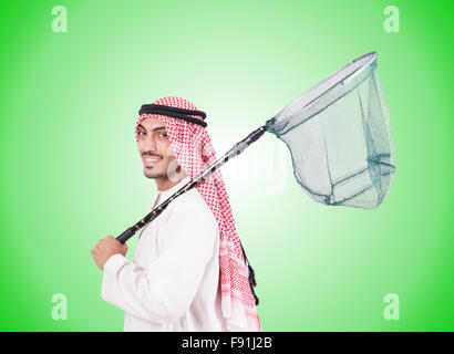 Arab businessman with catching net against gradient Stock Photo - Alamy