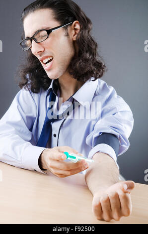 Young druc addict with syringe Stock Photo - Alamy